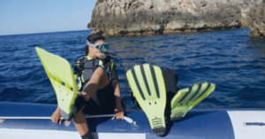Why do scuba divers fall backwards off boats to enter water